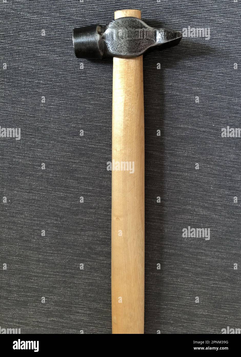 metalwork hammer with wooden handle Stock Photo - Alamy