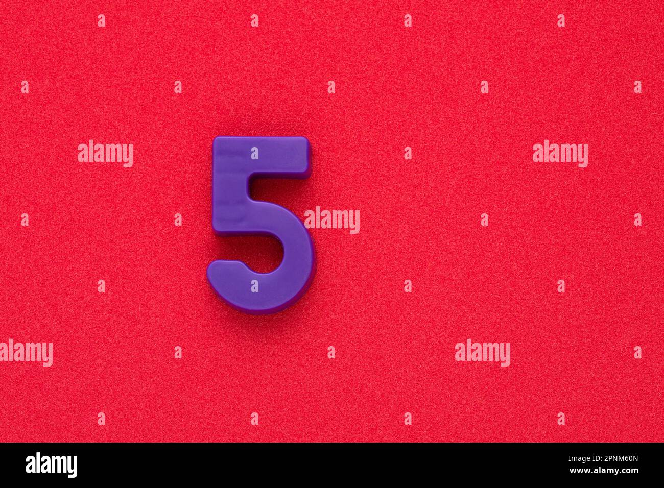 Purple number five (5) - Plastic digit on red background 032 c foamy ...