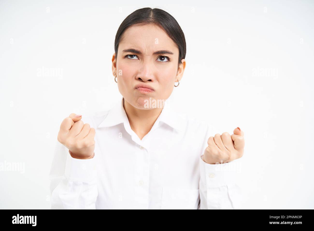 Portrait of angry, pissed-off businesswoman, japanese lady clenches ...