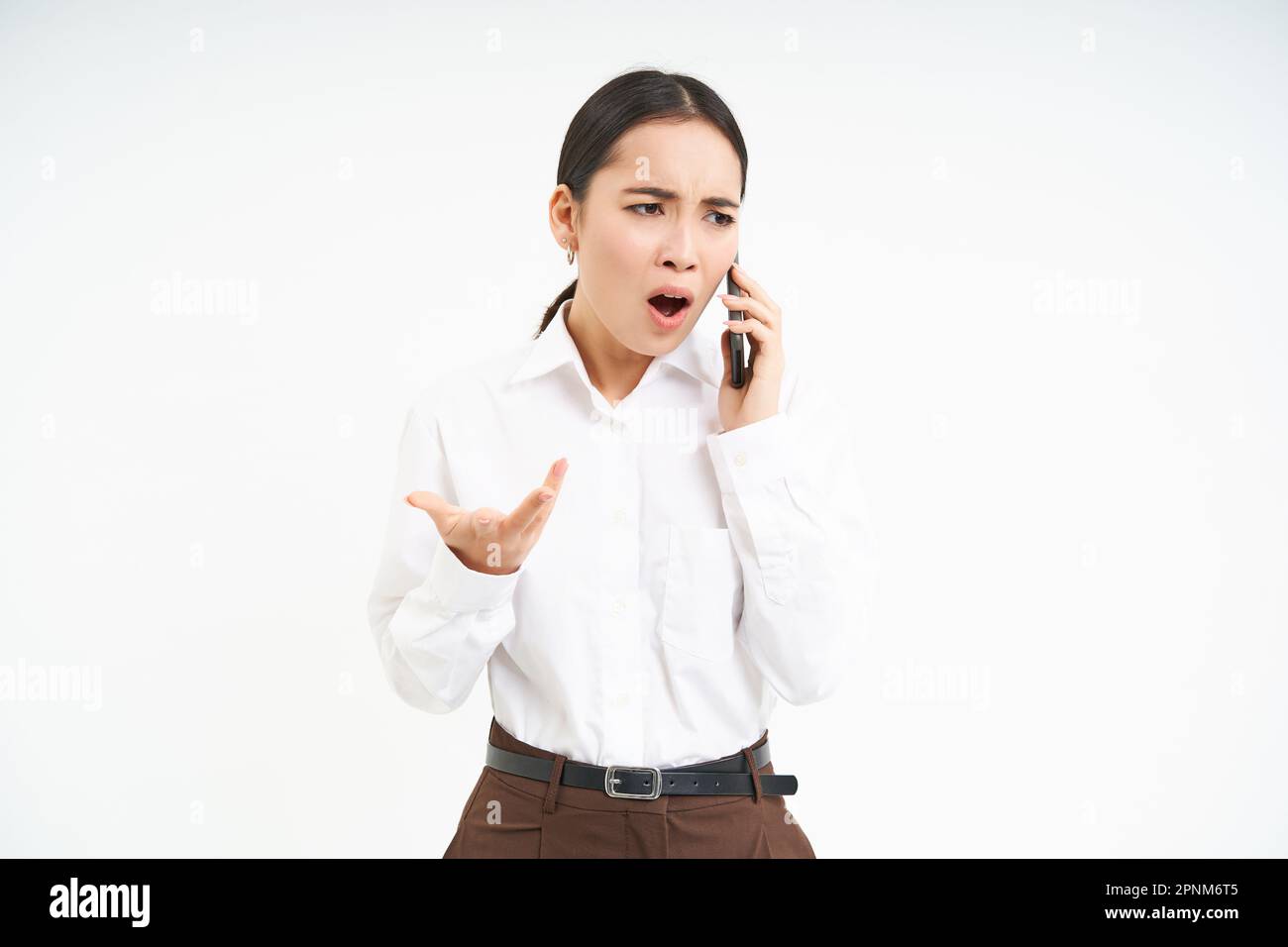 Angry business woman shouts at mobile phone, has intense conversation ...