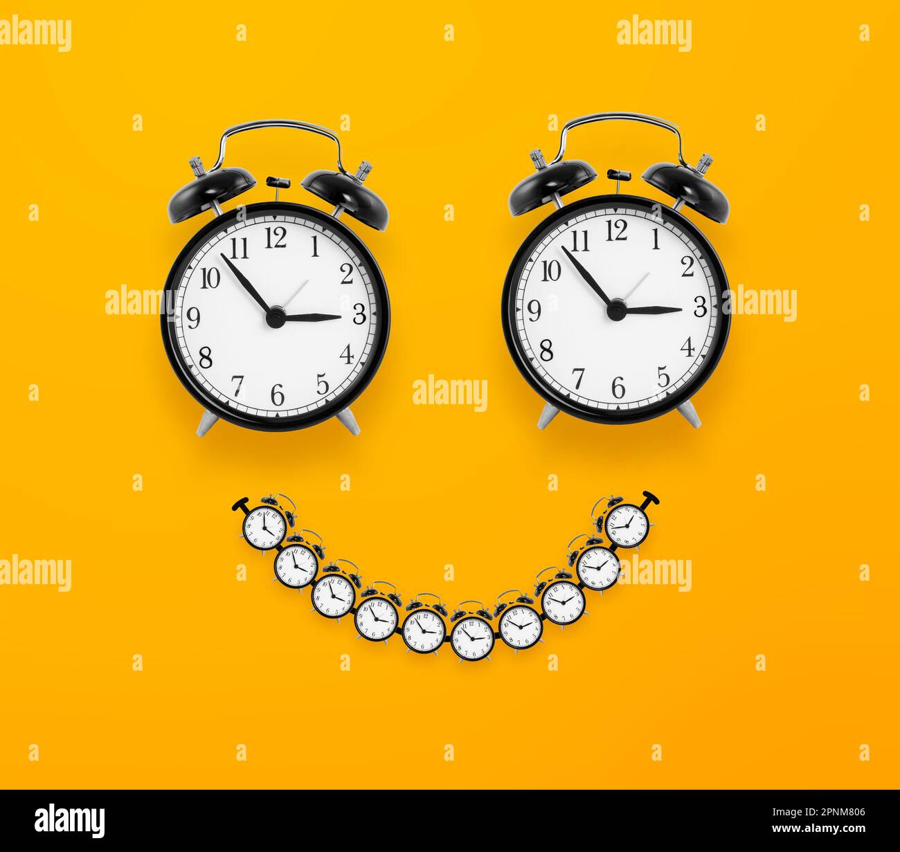 Smile look made from clocks on yellow background, happy time concept ...