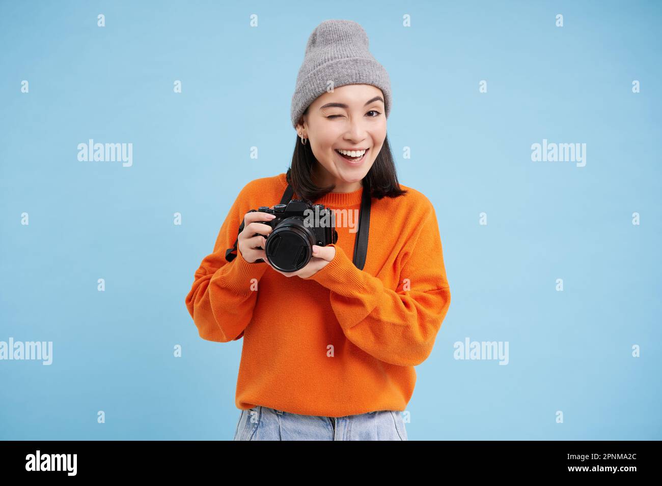 Passionate asian girl photographer, taking pictures on her digital ...