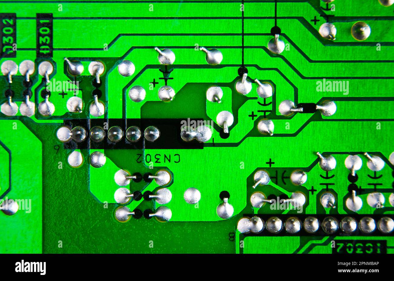 Close up of an green electronic circuit board with industry standard pin soldering, electronics ...