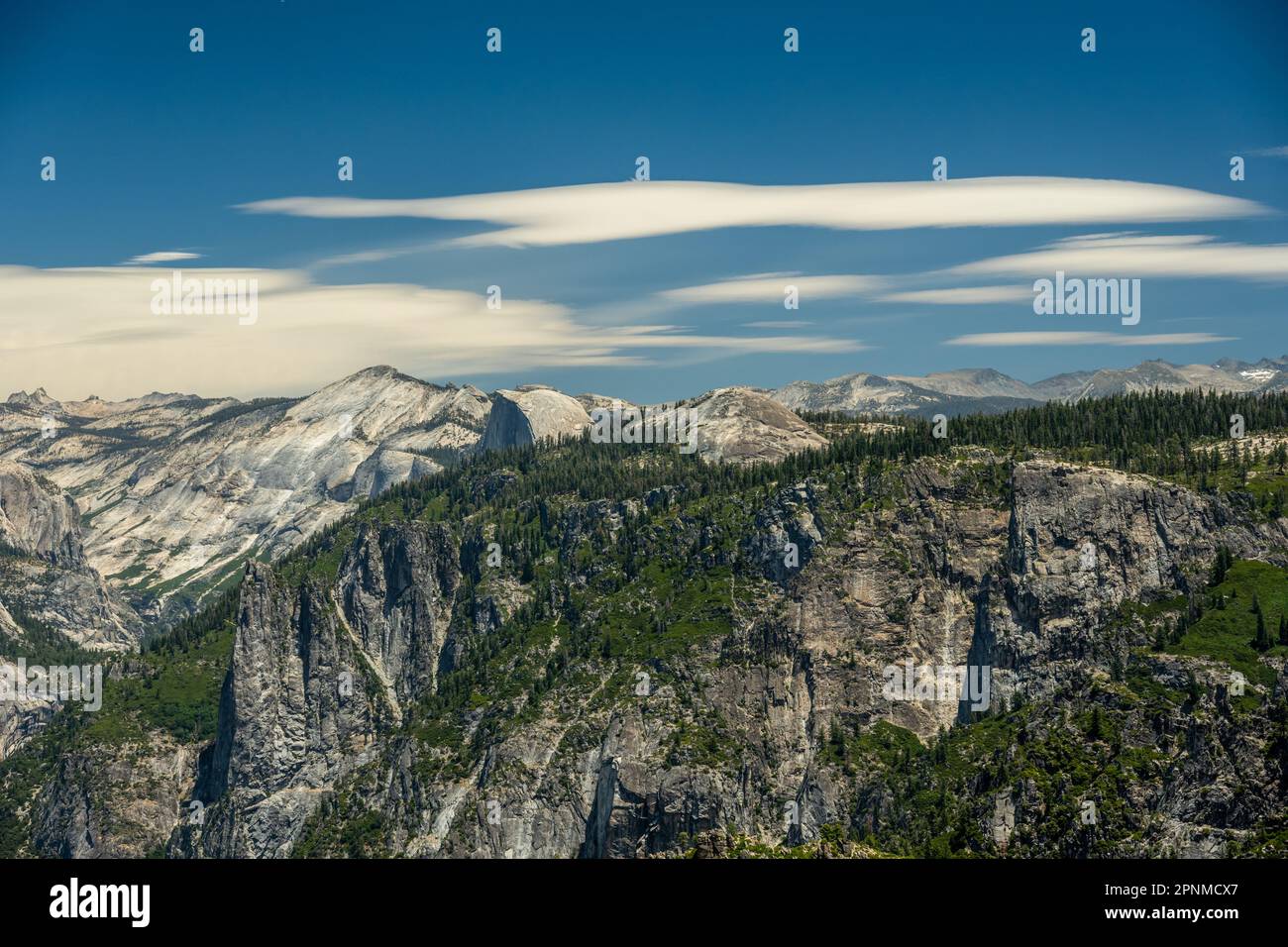 Half Dome Peeks Over The Ridge Of Sentinel Dome Below Smooth Clouds in ...