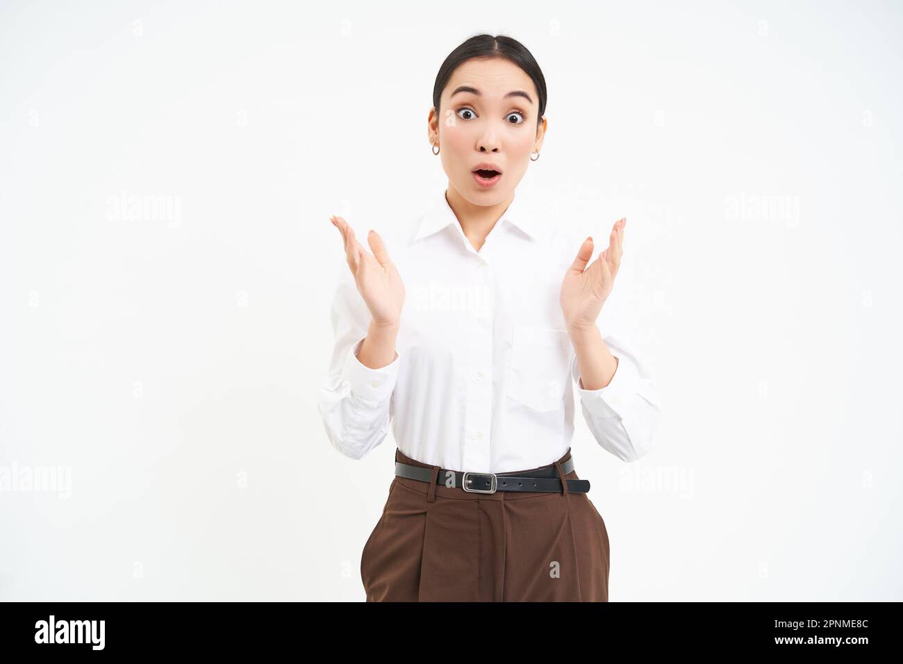 Impressed young female manager, claps hands with amazed face expression ...