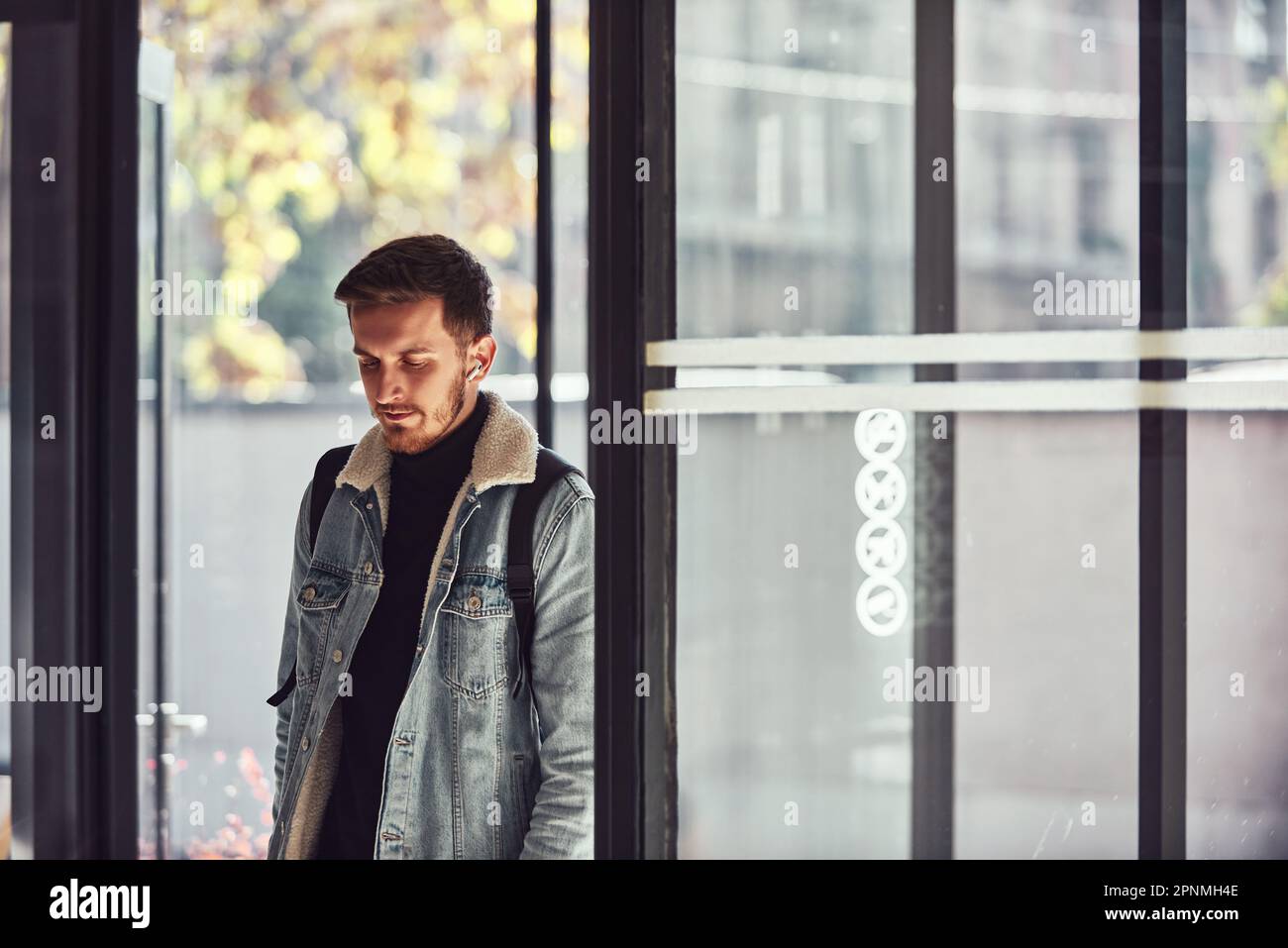 After finishing his work, a man steps out of his office while carrying ...