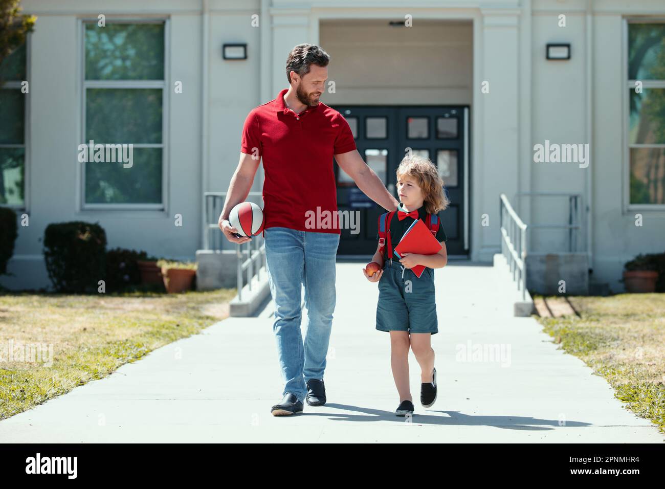 Outdoor school. School boy going to school with father. Happy Dad and ...
