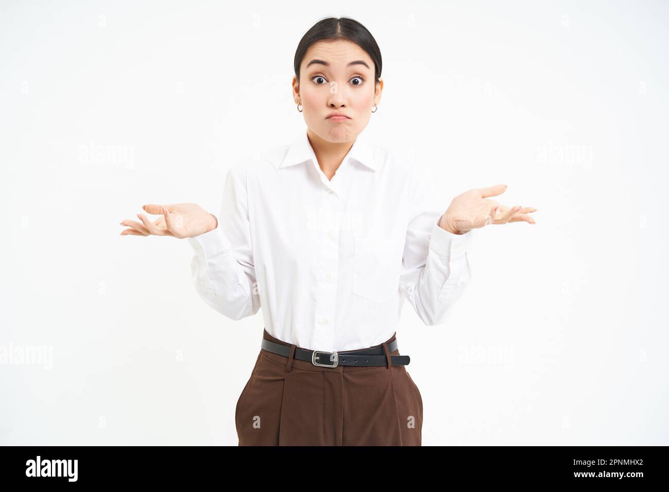 Clueless asian corporate woman, shrugs shoulders with puzzled face ...