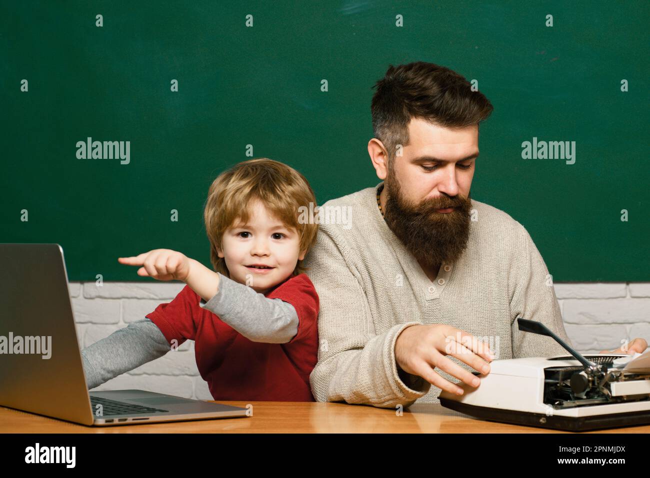 Little students. Teacher and kid. Daddy play with schoolboy. Daddy and ...