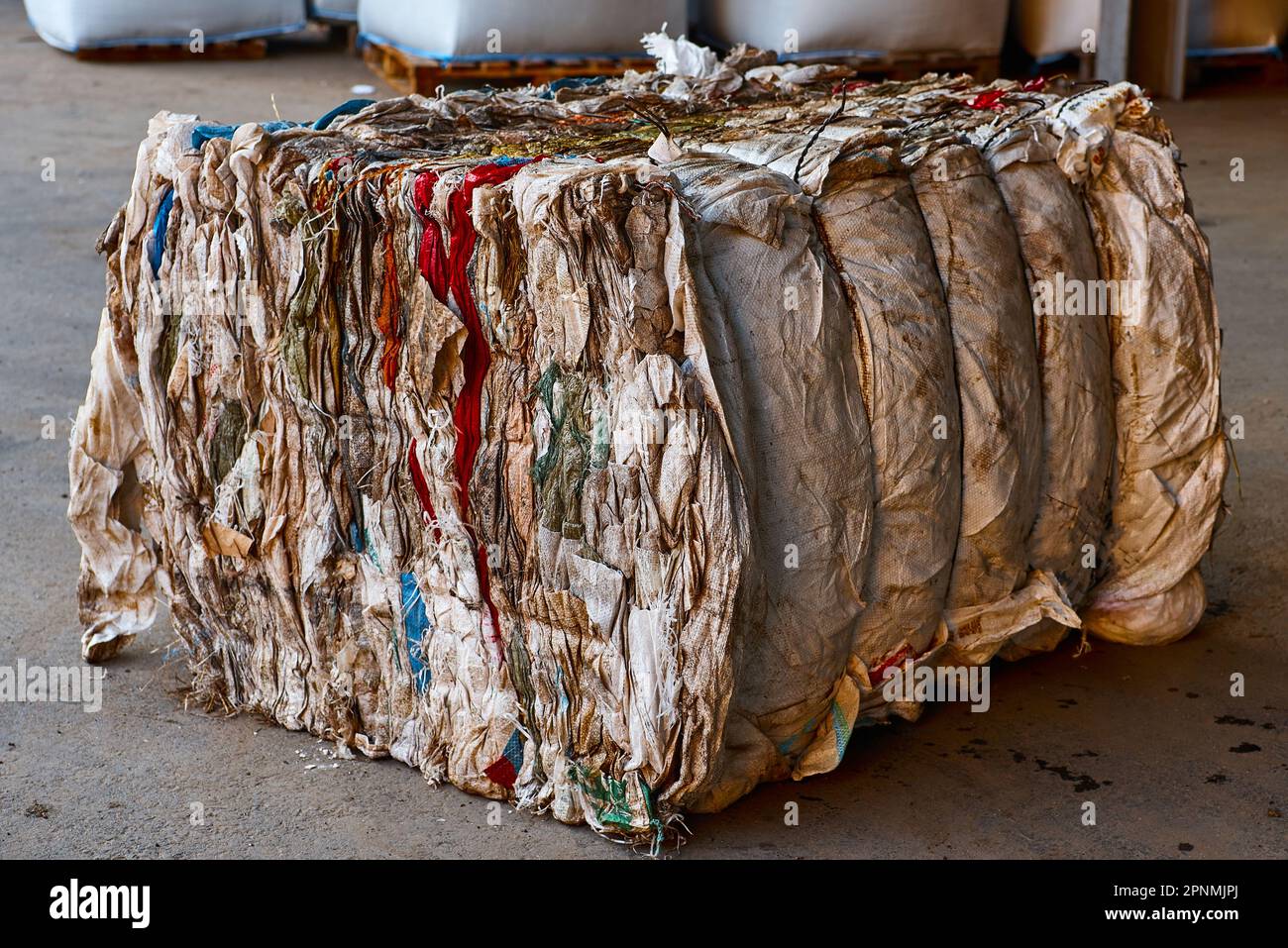 Block of pressed plastic material at recycling plant storage Stock ...