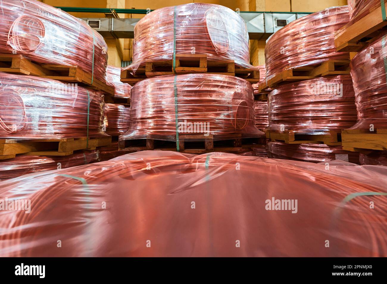 Stacks of copper wire rods in production plant warehouse Stock Photo ...