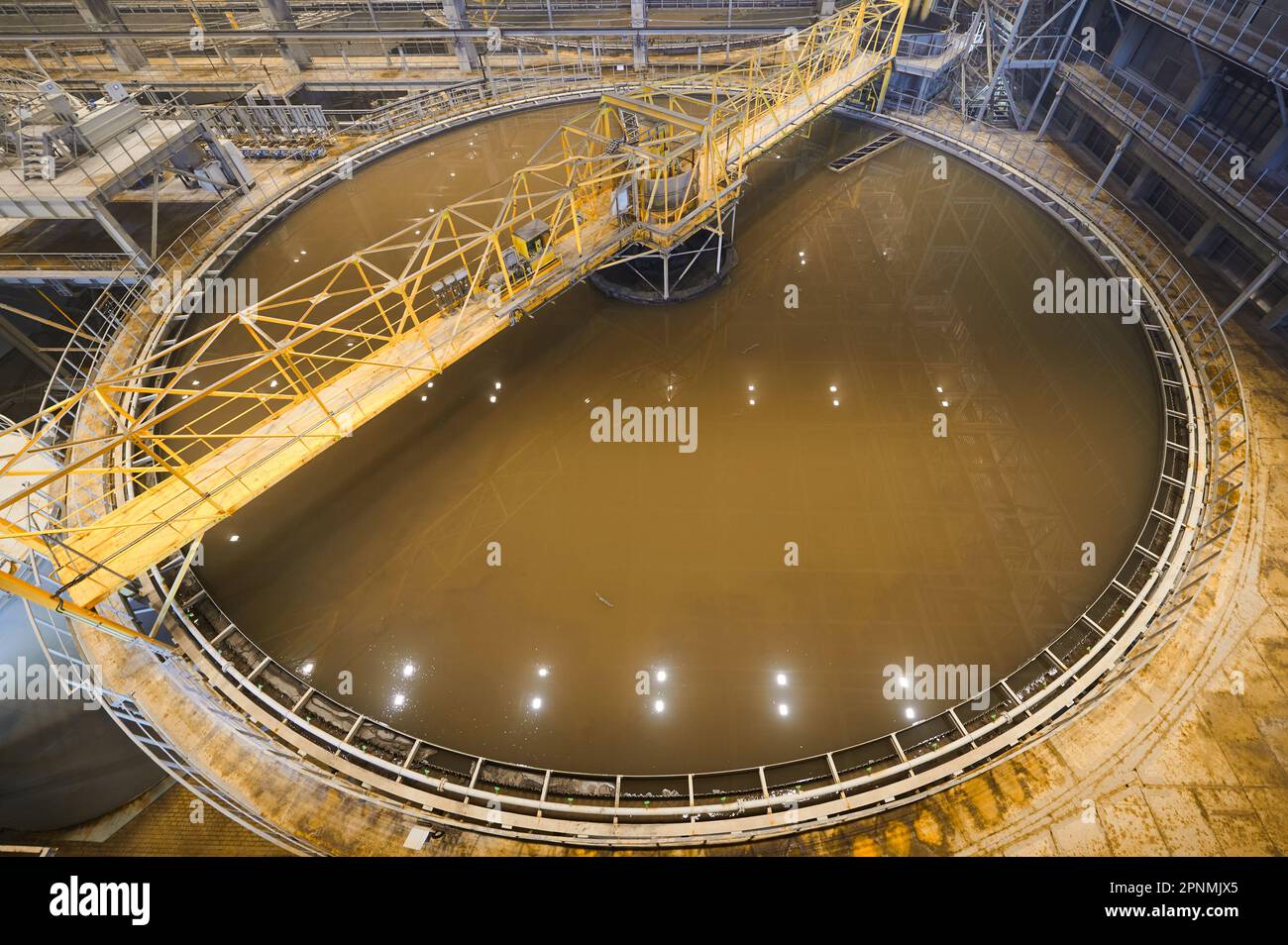 Huge container to separate liquid pulp material in workshop Stock Photo ...