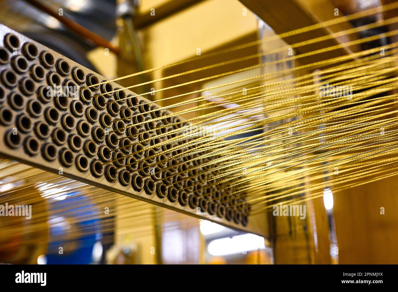 Bar with holes and strained wires in rolled steel workshop Stock Photo ...