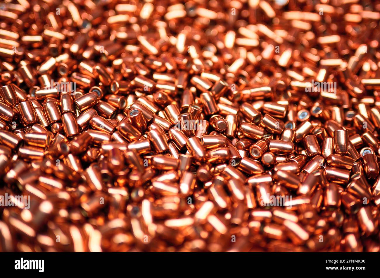 Sparkling golden bullets heap for firearms as background Stock Photo ...