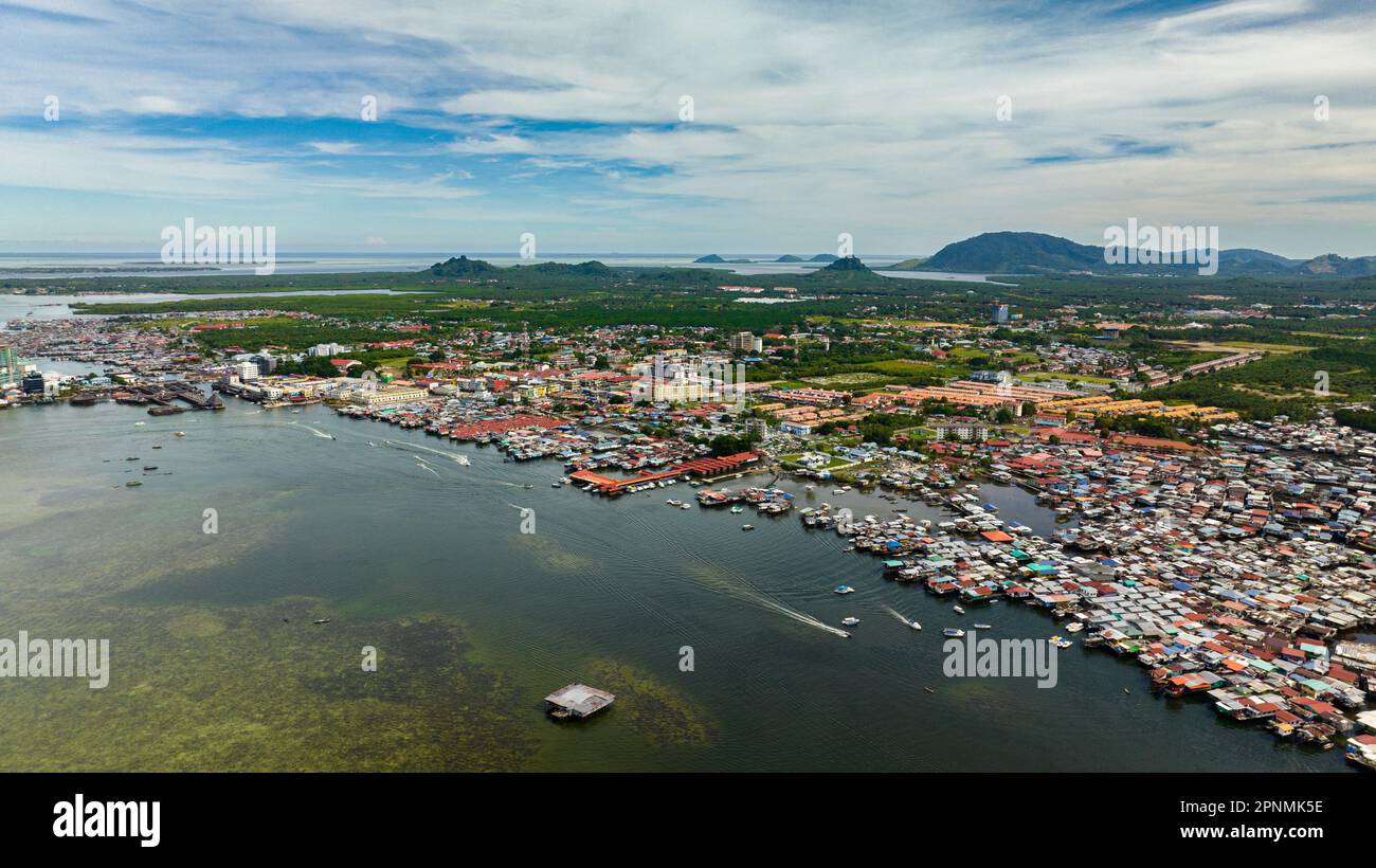 Aerial drone of traditional stilt houses of poor people in the town of ...