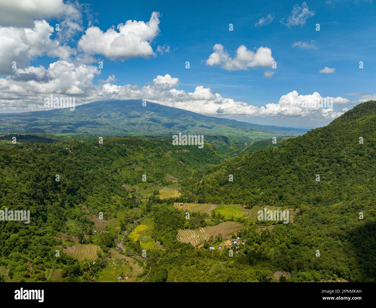 Aerial view of mountain slopes with rainforest and a mountain valley ...