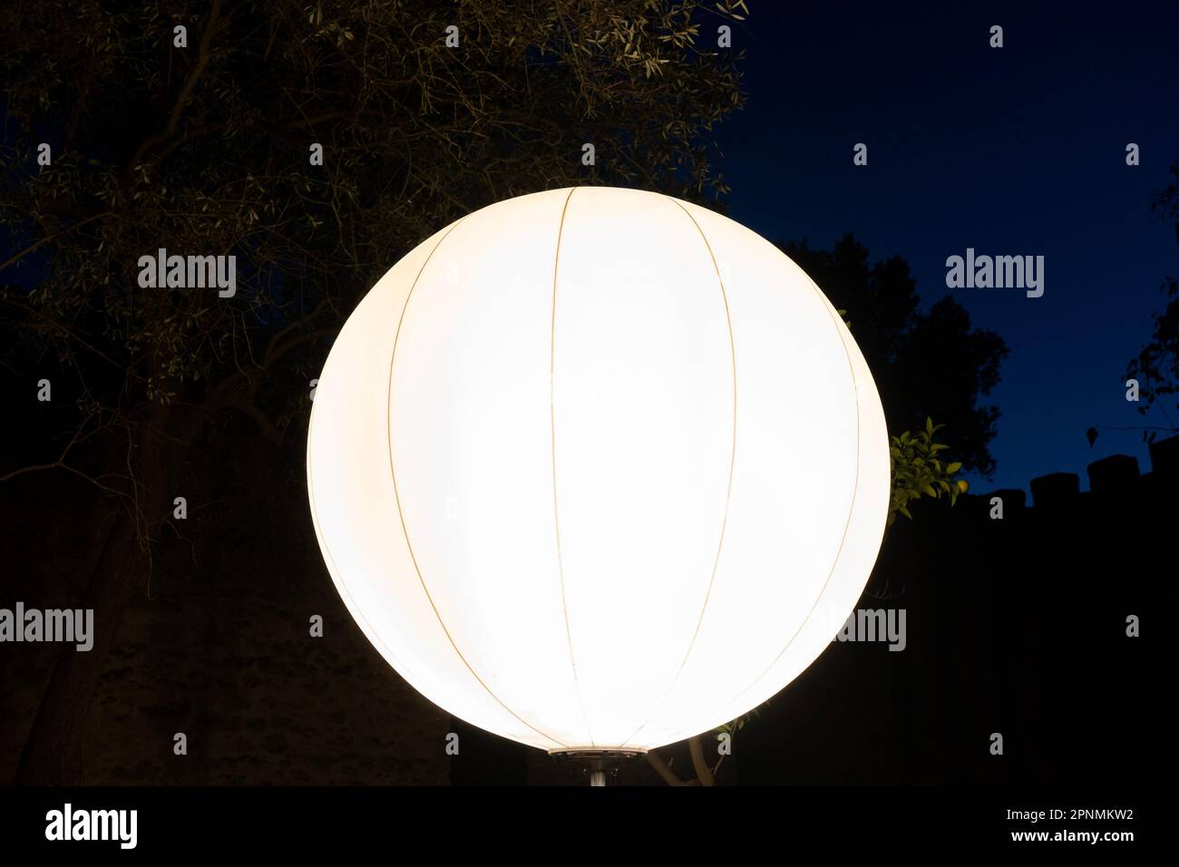 Close up of round bright light shade lighted up in the darkness Stock ...