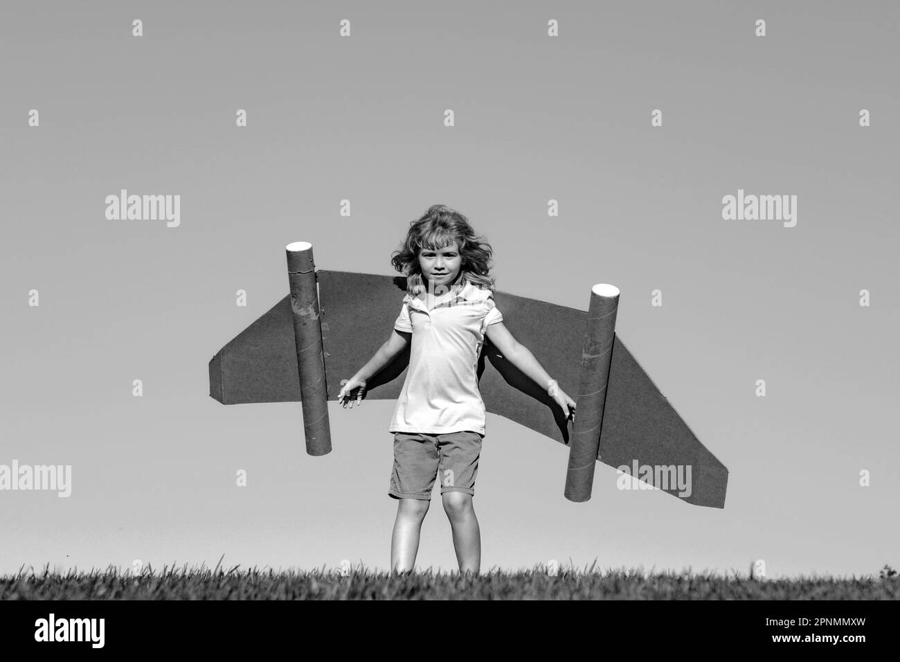 Kid imagination, child pilot with paper wings having fun at outdoor ...
