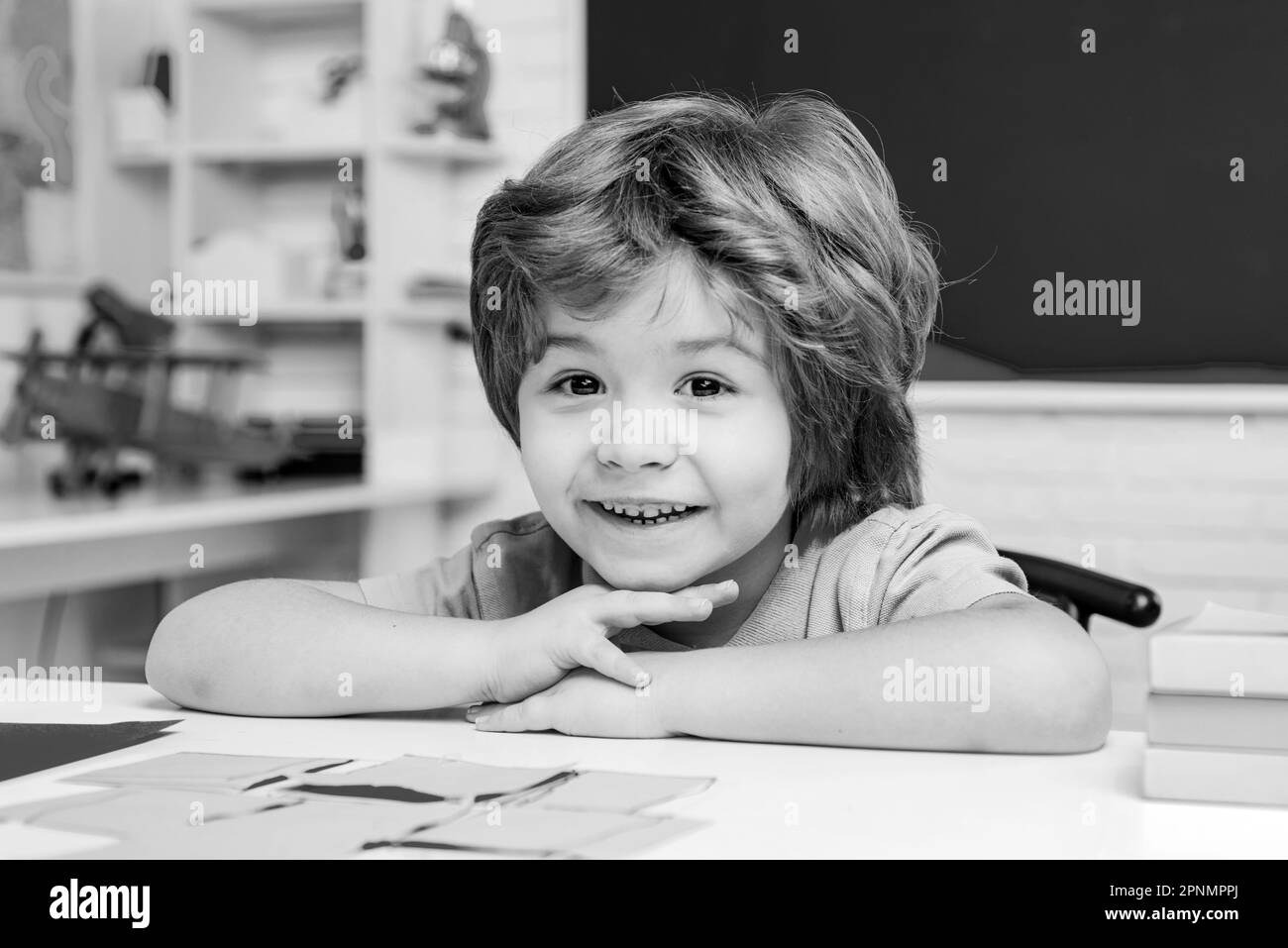Cute little preschool kid boy with teacher study in a classroom Stock ...