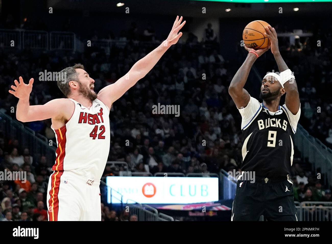 Milwaukee Bucks' Bobby Portis (9) shoots against Miami Heat's Kevin ...
