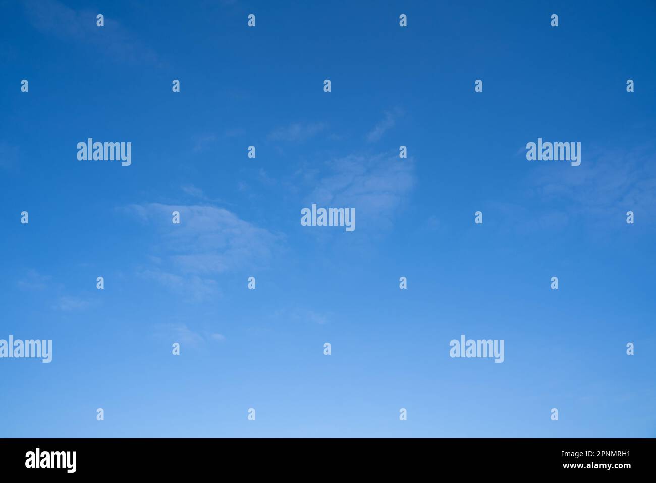 Blue sunny sky with few clouds in spring Stock Photo - Alamy