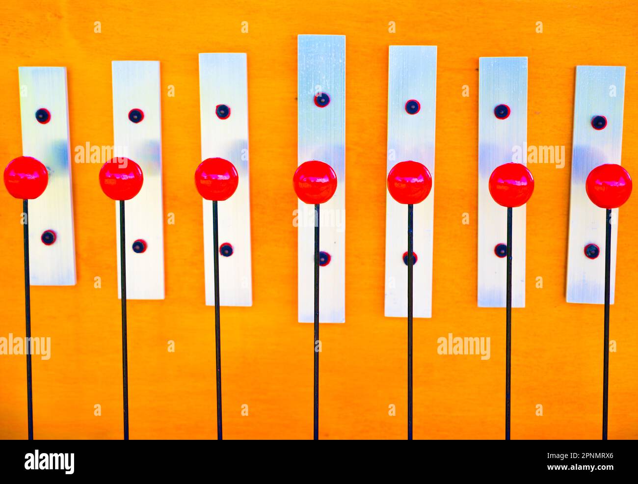 Colourful xylophone display with red and yellow colours Stock Photo - Alamy