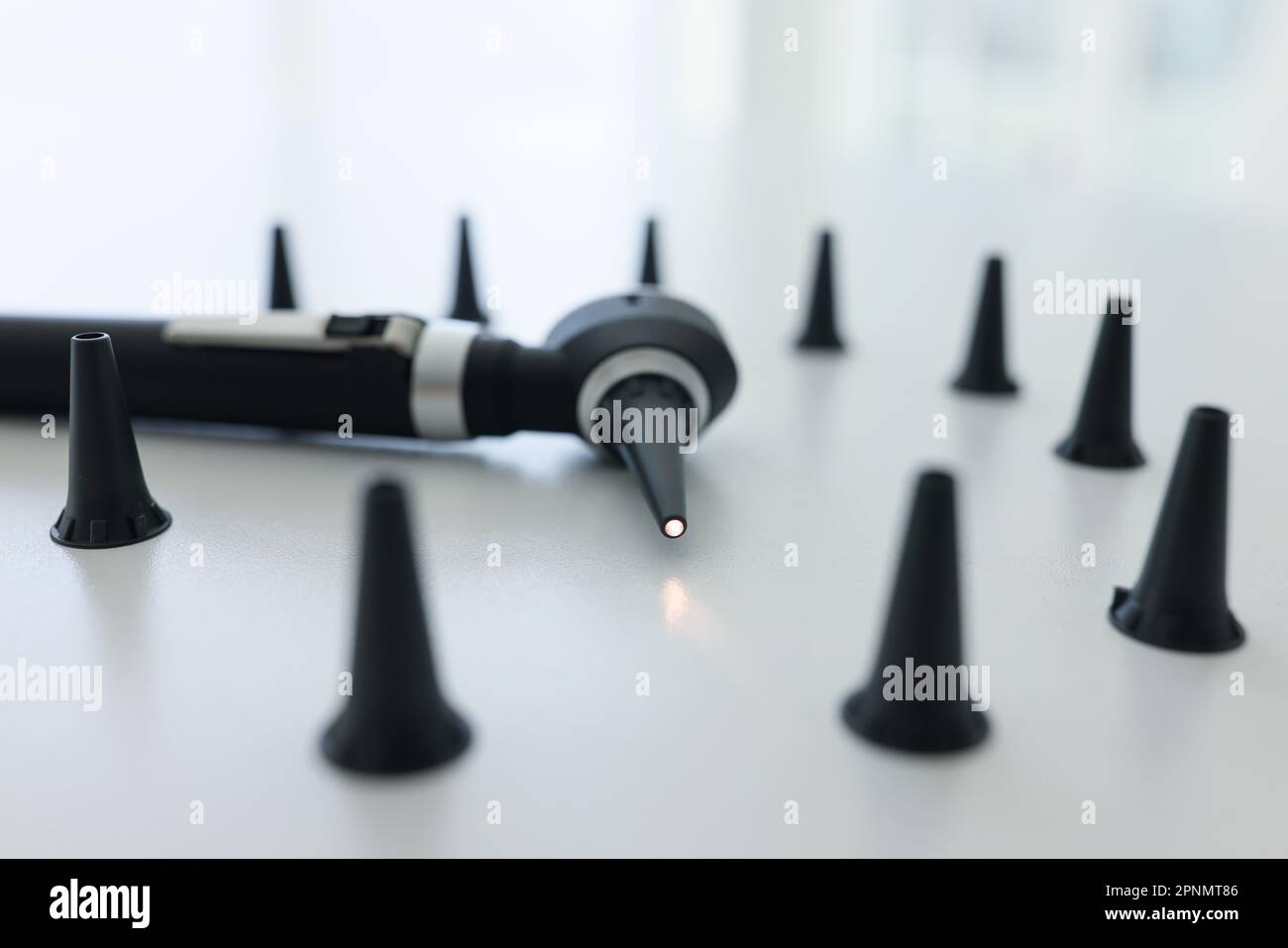 Modern otoscope with light on tip and caps for ear checkup Stock Photo ...