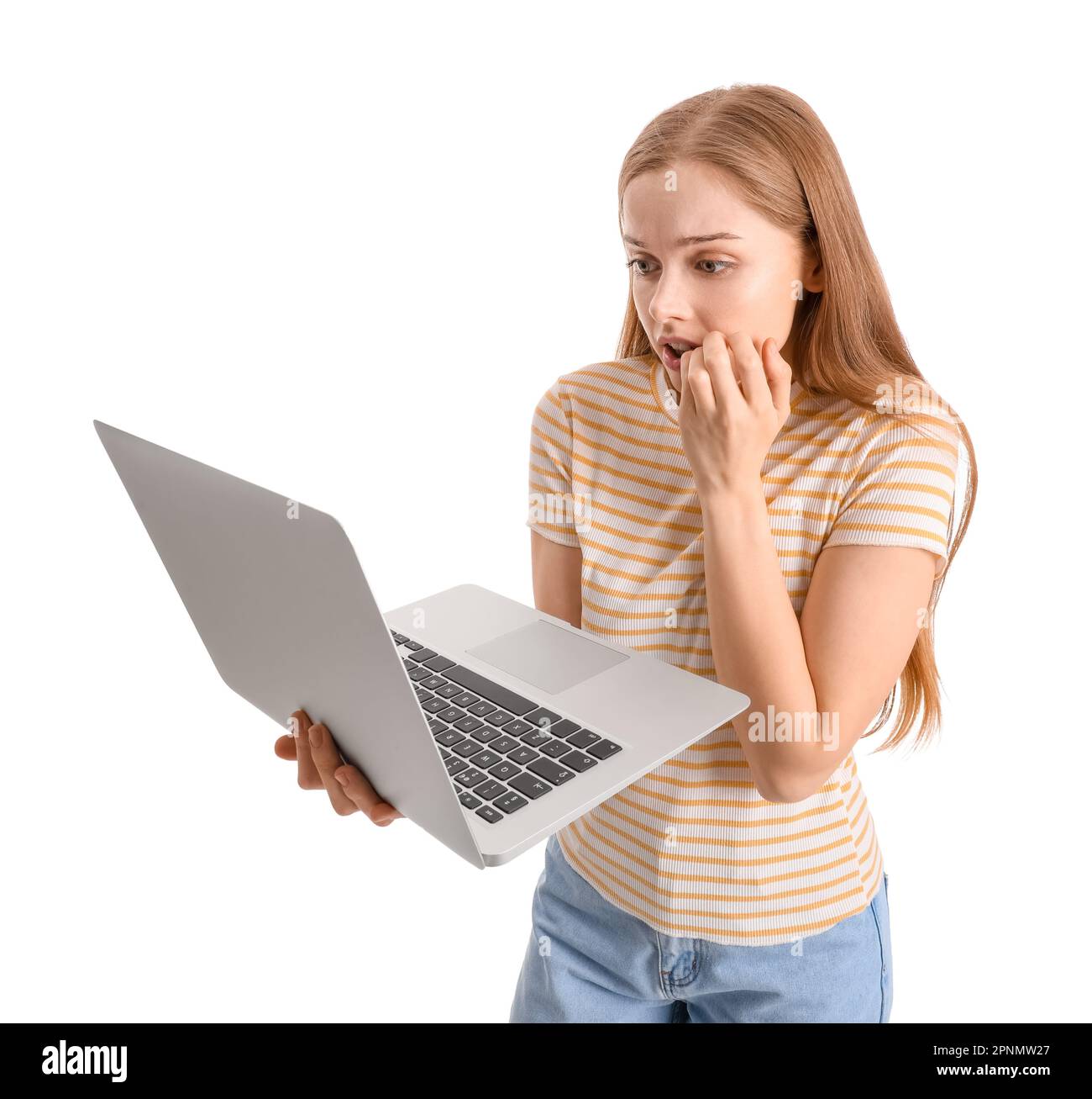 Young woman with laptop biting nails on white background Stock Photo ...