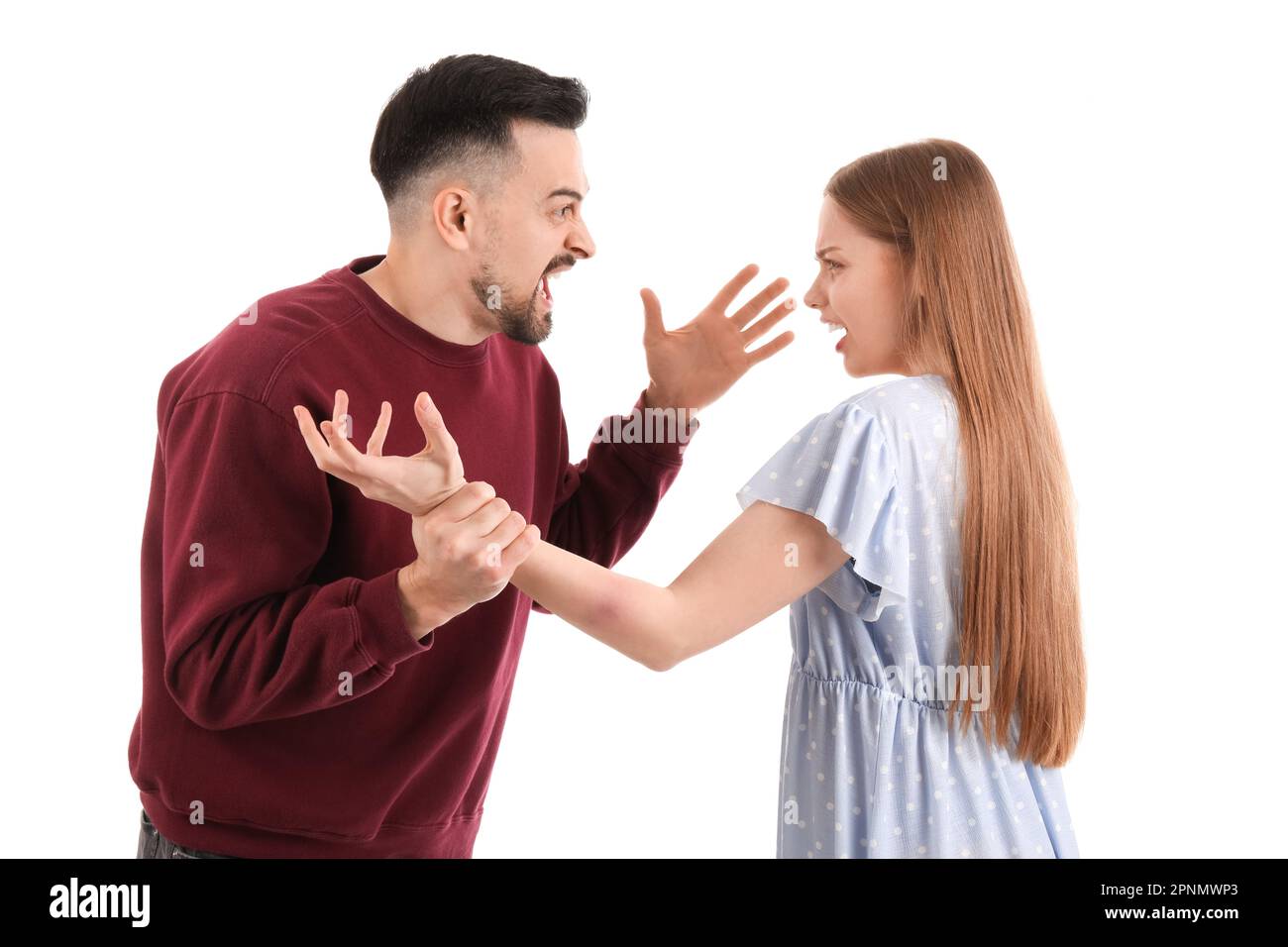 Angry young couple shouting on white background. Domestic violence ...