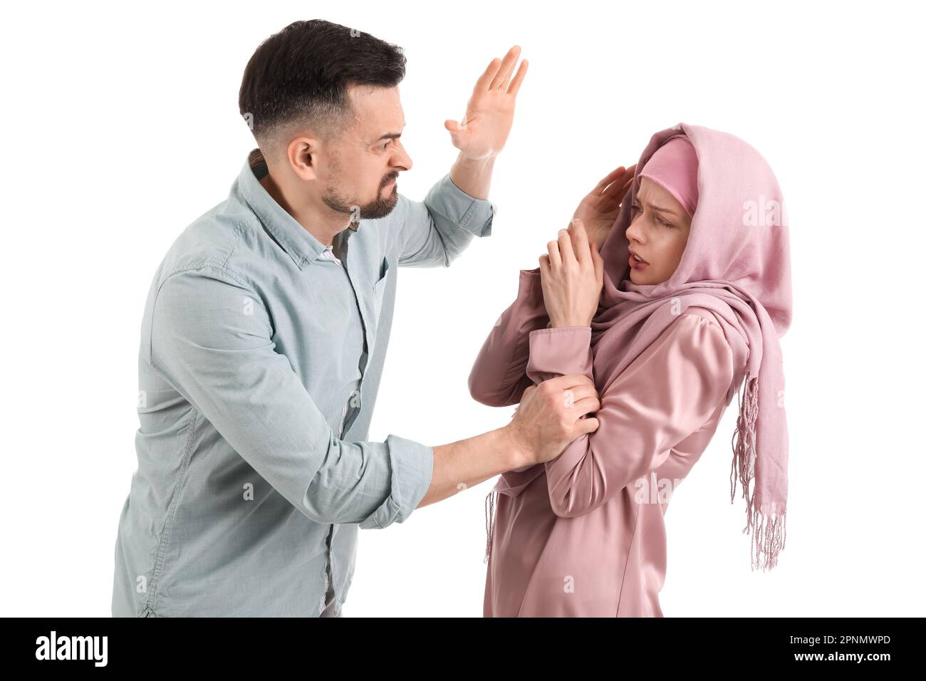 Angry Muslim man threatening his wife on white background. Domestic ...
