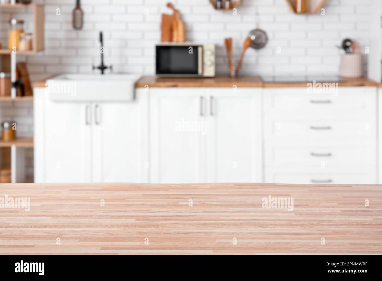 Empty table in interior of modern kitchen Stock Photo - Alamy