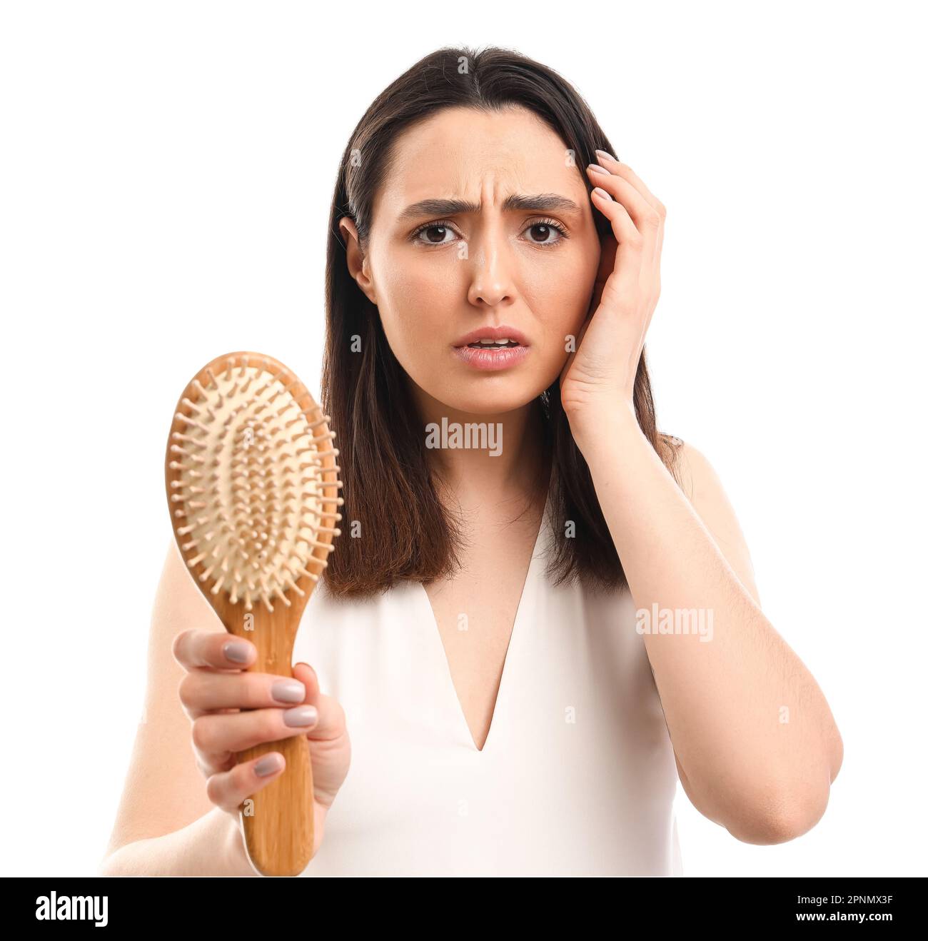 Worried young woman with hair loss problem on white background Stock ...