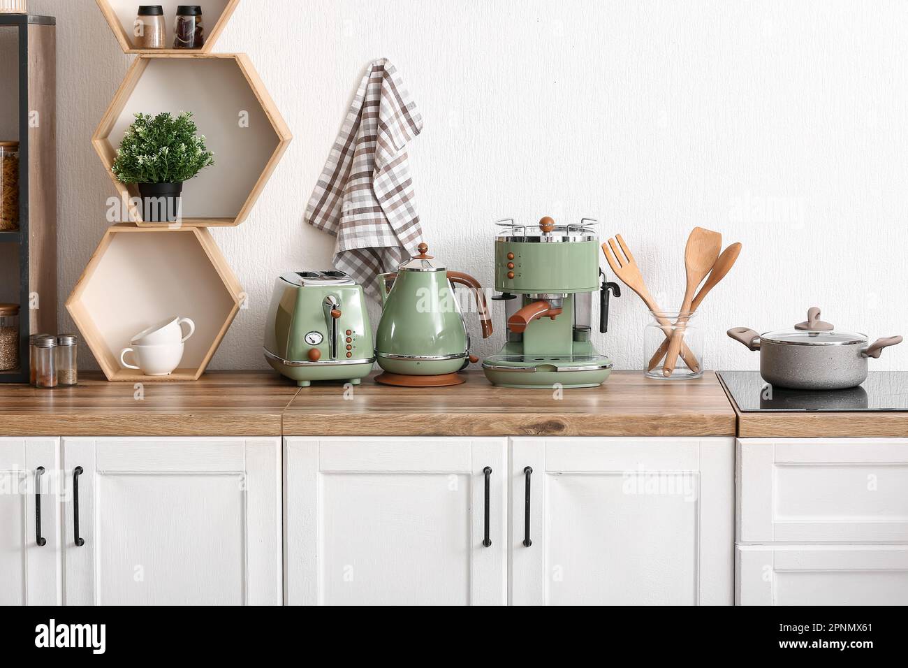 Coffee machine, toaster and electric kettle on kitchen counter Stock Photo - Alamy