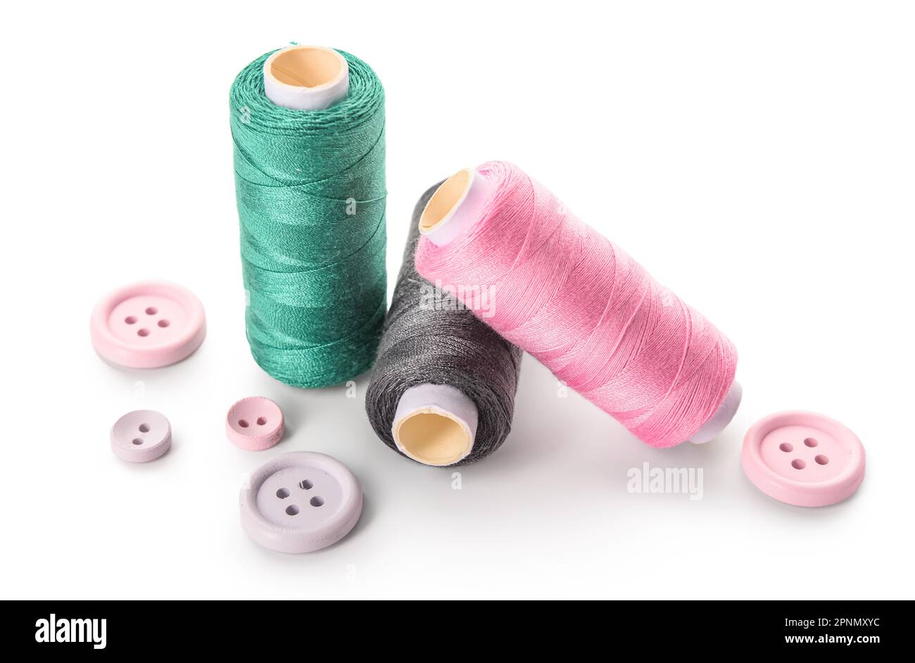 Thread spools and buttons isolated on white background Stock Photo - Alamy