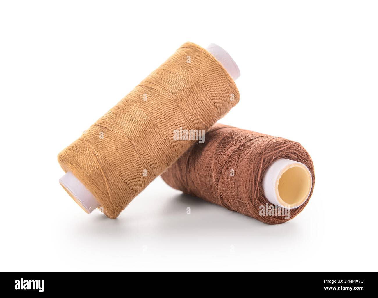 Two thread spools isolated on white background Stock Photo - Alamy