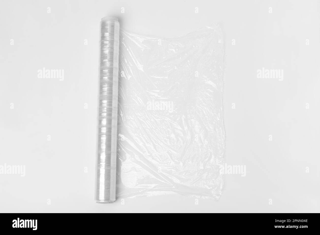 Roll of stretch wrap on white background Stock Photo - Alamy