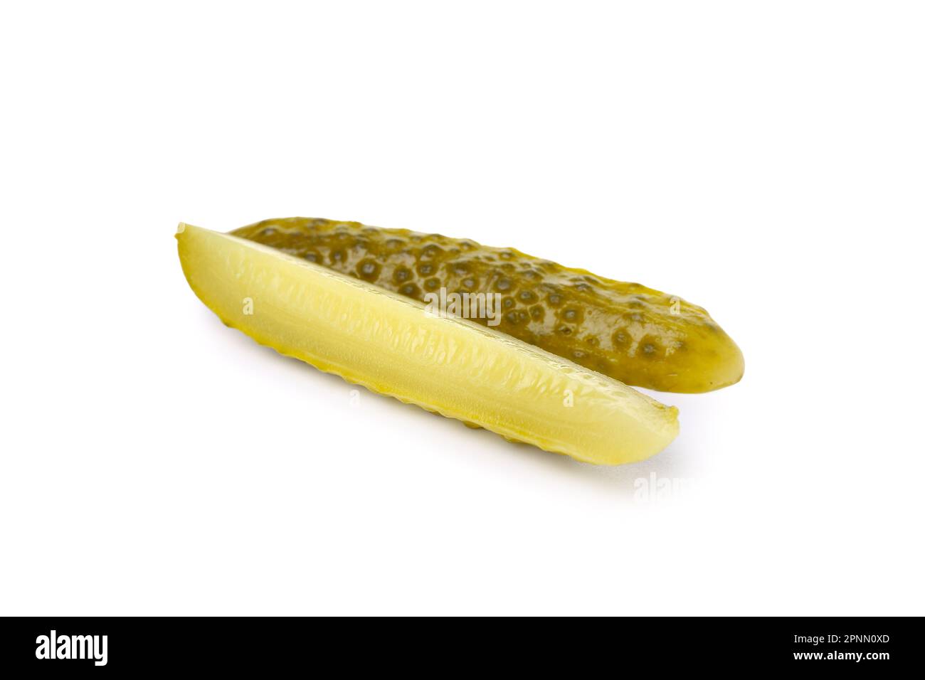 Tasty fermented cucumber slices on white background Stock Photo - Alamy