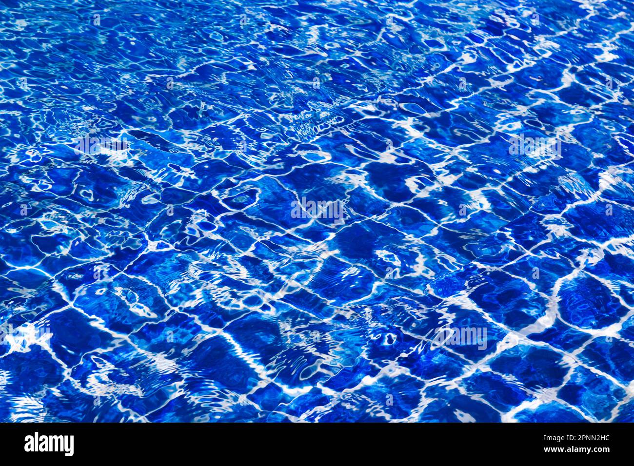 Blue color water in swimming pool rippled background Stock Photo - Alamy