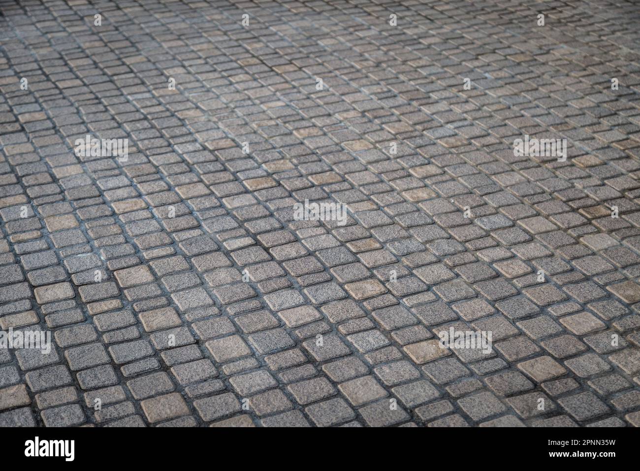 Cobblestone pavement texture background Stock Photo - Alamy