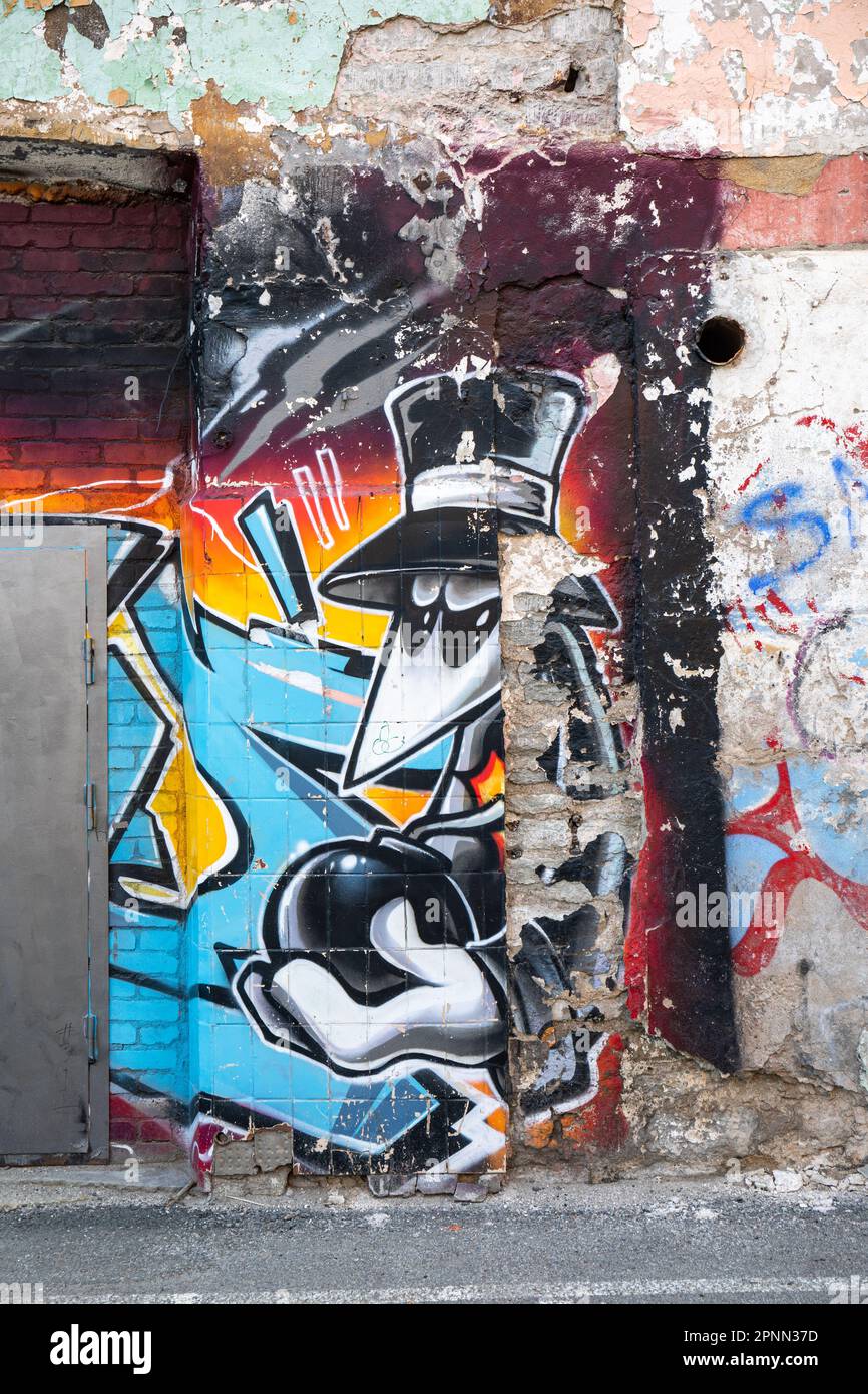 Street art. Partly damaged Spy vs. Spy mural graffiti in Telliskivi ...
