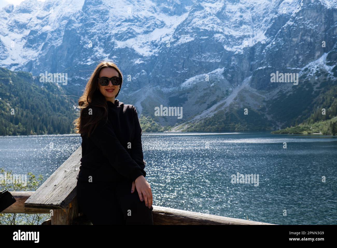 Young woman enjoying nature in Morskie Oko Snowy Mountain Hut in Polish ...
