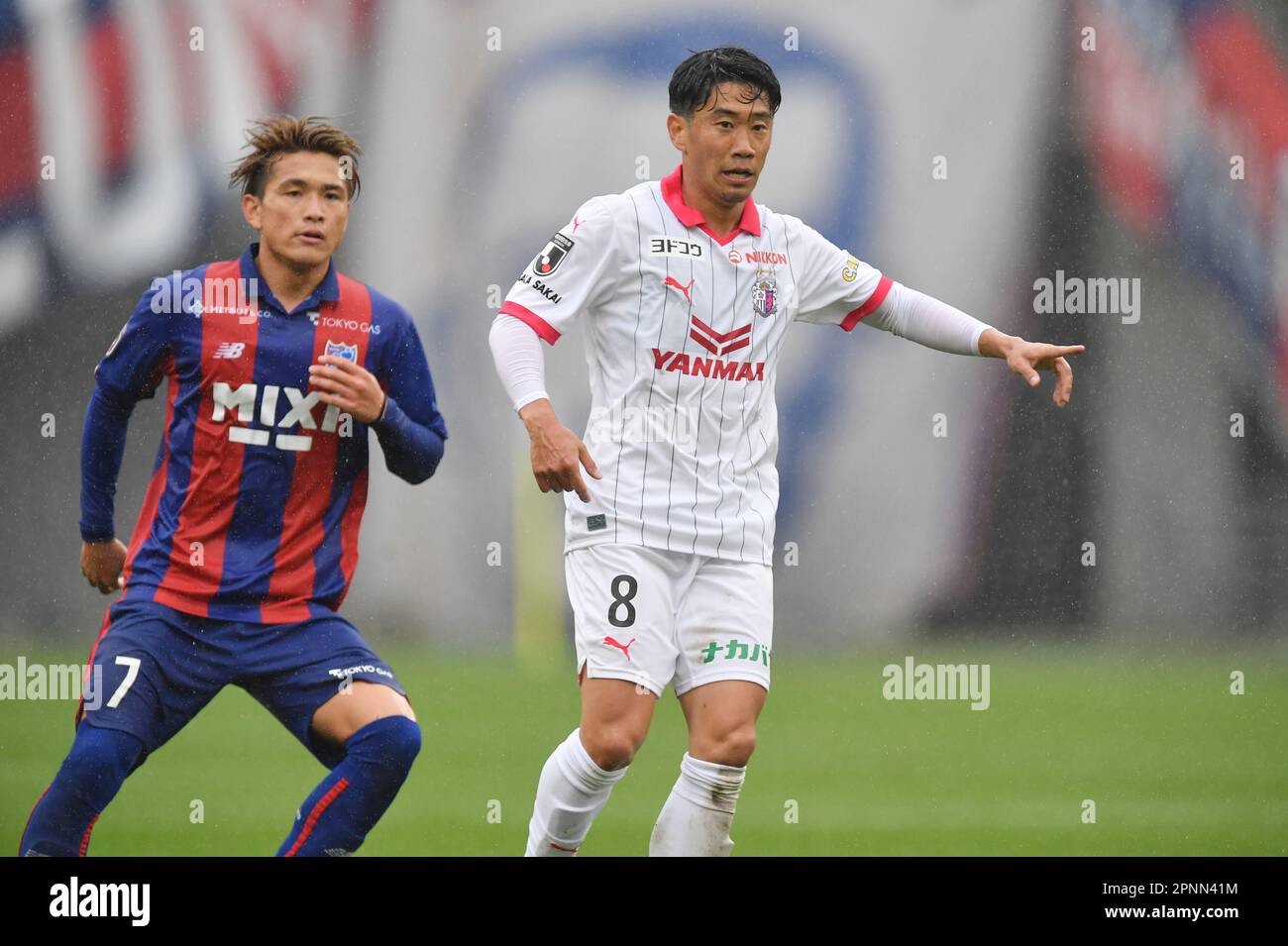 Tokyo, Japan. 15th Apr, 2023. FC Tokyo's Kuryu Matsuki, left, and Cerezo Osaka's Shinji Kagawa ...
