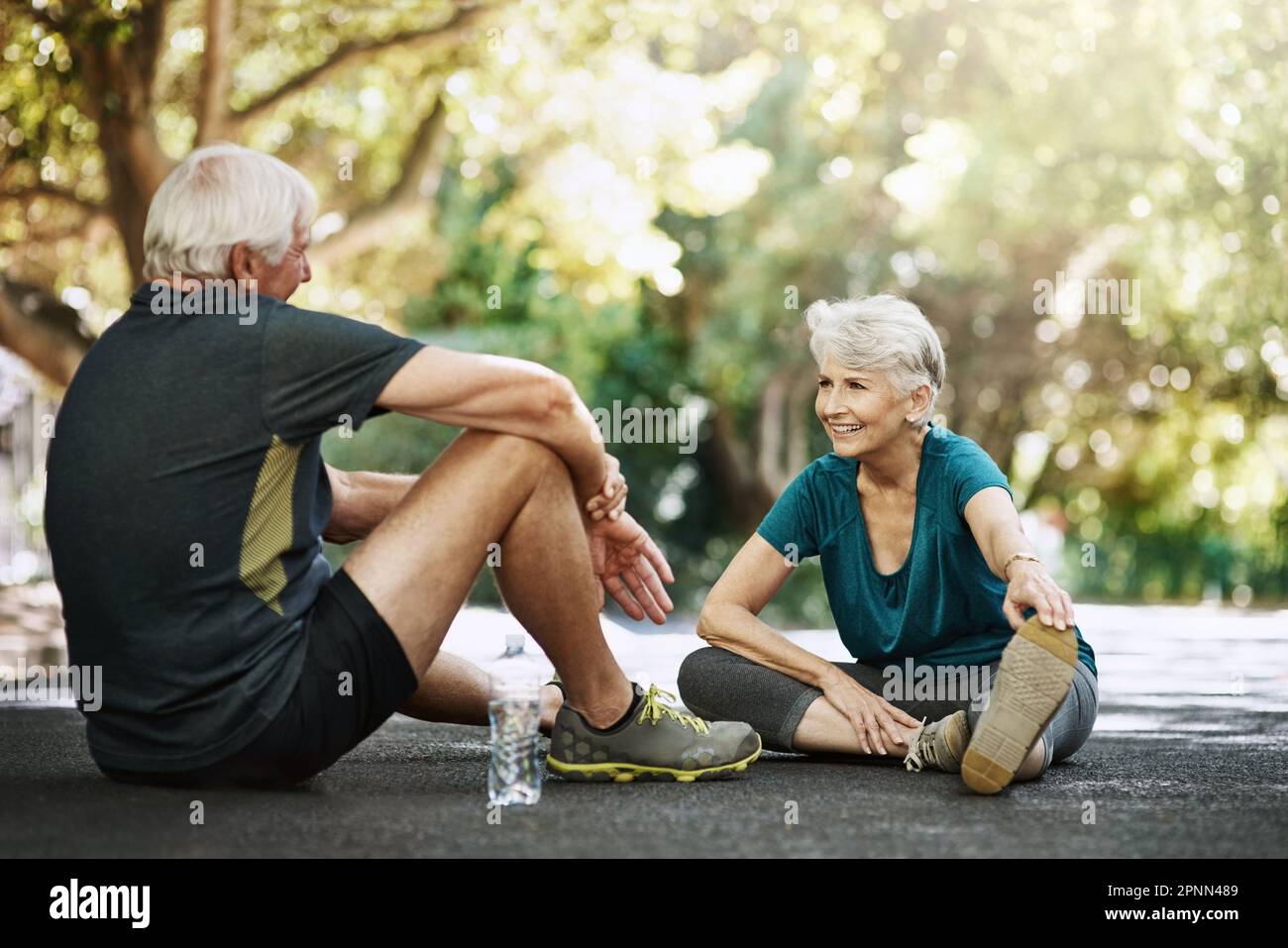 Staying in shape as they age. a senior couple taking a break while out ...