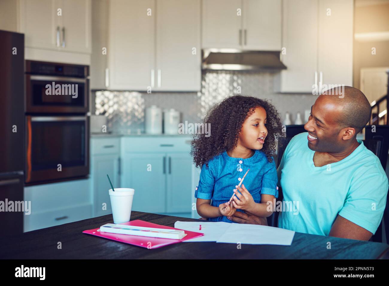 Im going to paint your portrait, daddy. a cute little girl and her ...