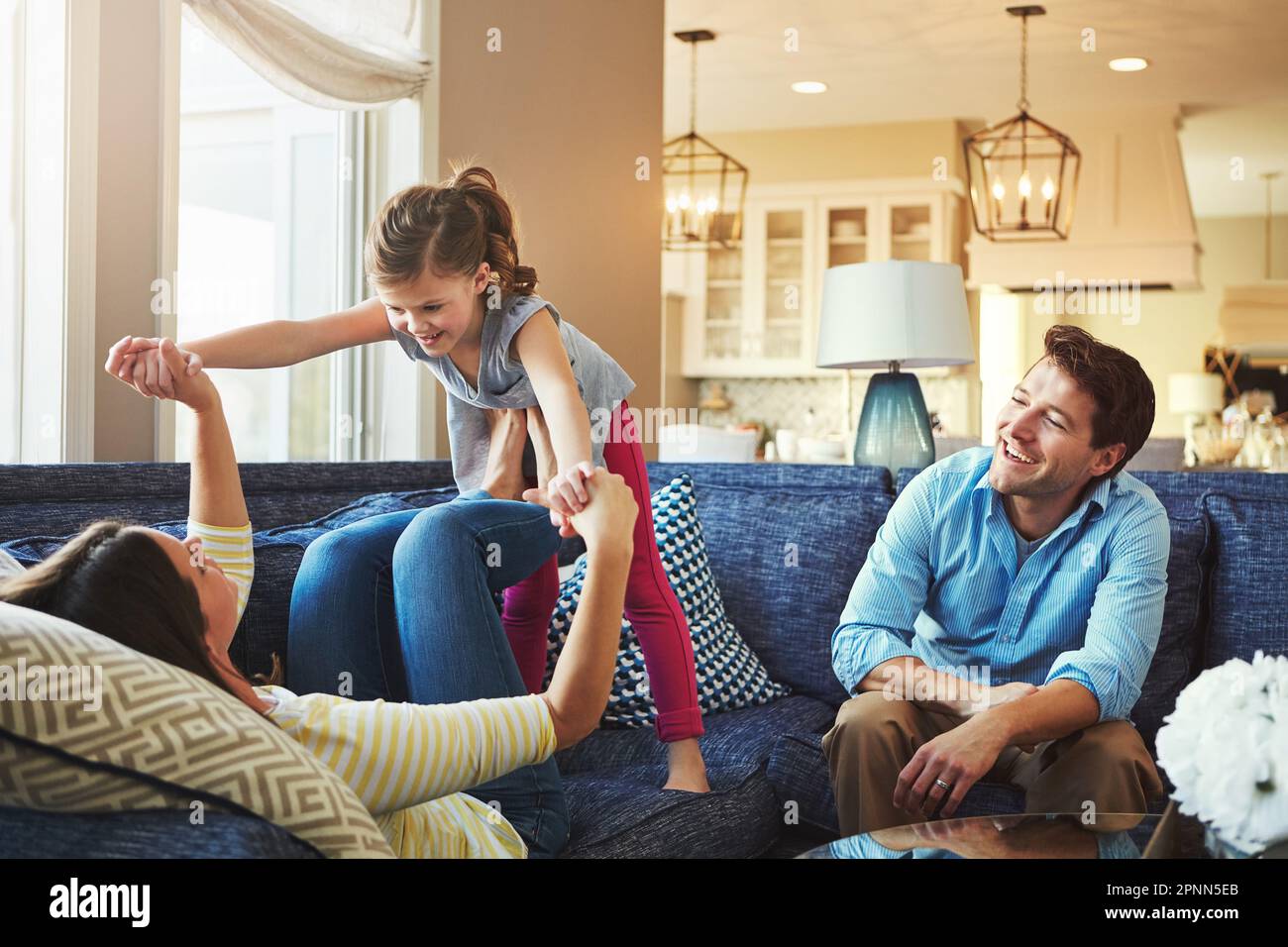 Enjoying the day filled with boundless joy. a happy family bonding ...