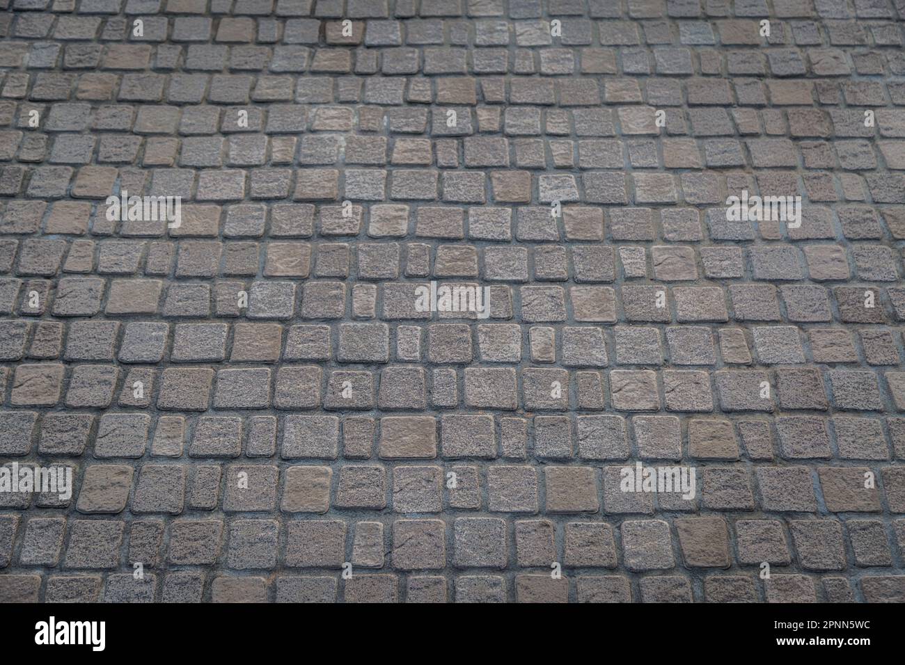 Cobblestone pavement texture background Stock Photo - Alamy