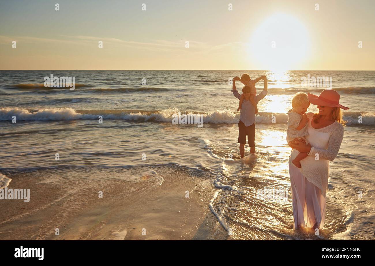 Its been one awesome family vacation. a young family enjoying a day at ...