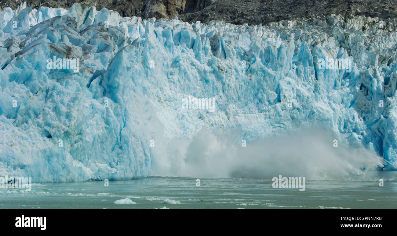 Spectacular glacier calving. Ice cubes fell into the water like an ...