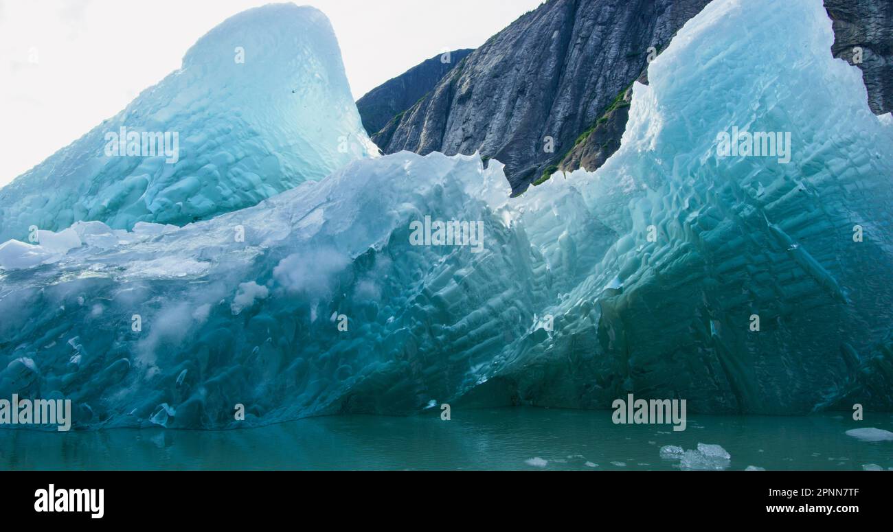 Watch the ice floes and icebergs on the river in a small boat. Rocks ...