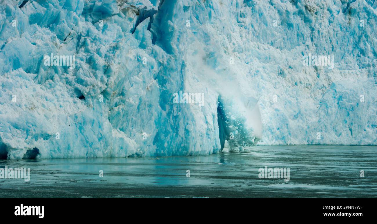 Spectacular glacier calving. Ice cubes fell into the water like an ...